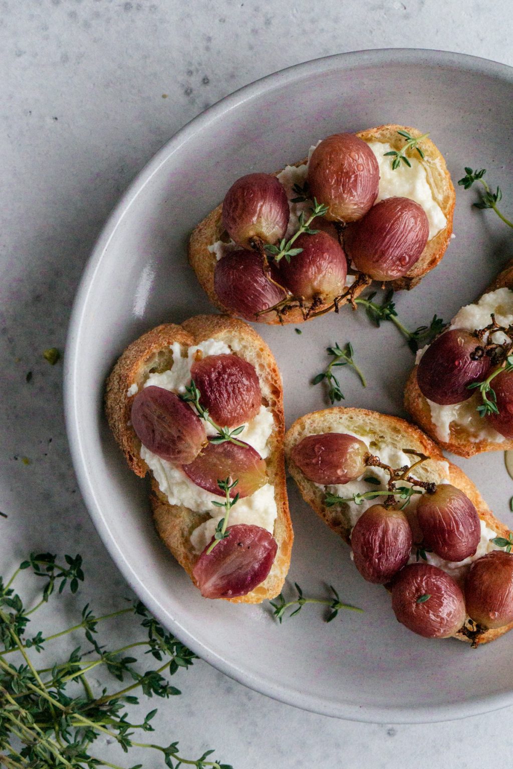 Roasted Grape Crostini With Whipped Ricotta and Honey - Pina Bresciani